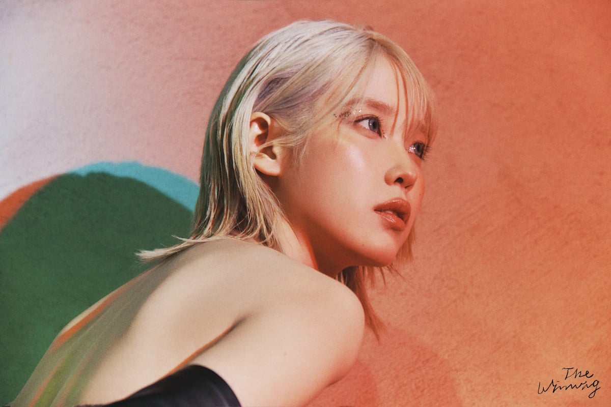 IU reveals striking concept photos for 'The Winning' mini album | allkpop