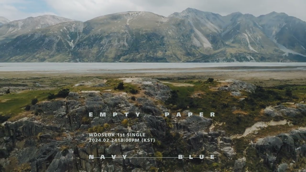 Pentagon's Wooseok sings on top a mountain in 'Navy Blue' MV teaser ...